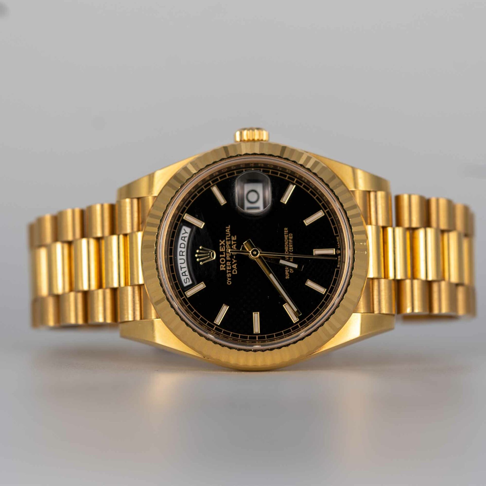 Buy Rolex Day-Date 40 Yellow Gold with Black Motif Dial