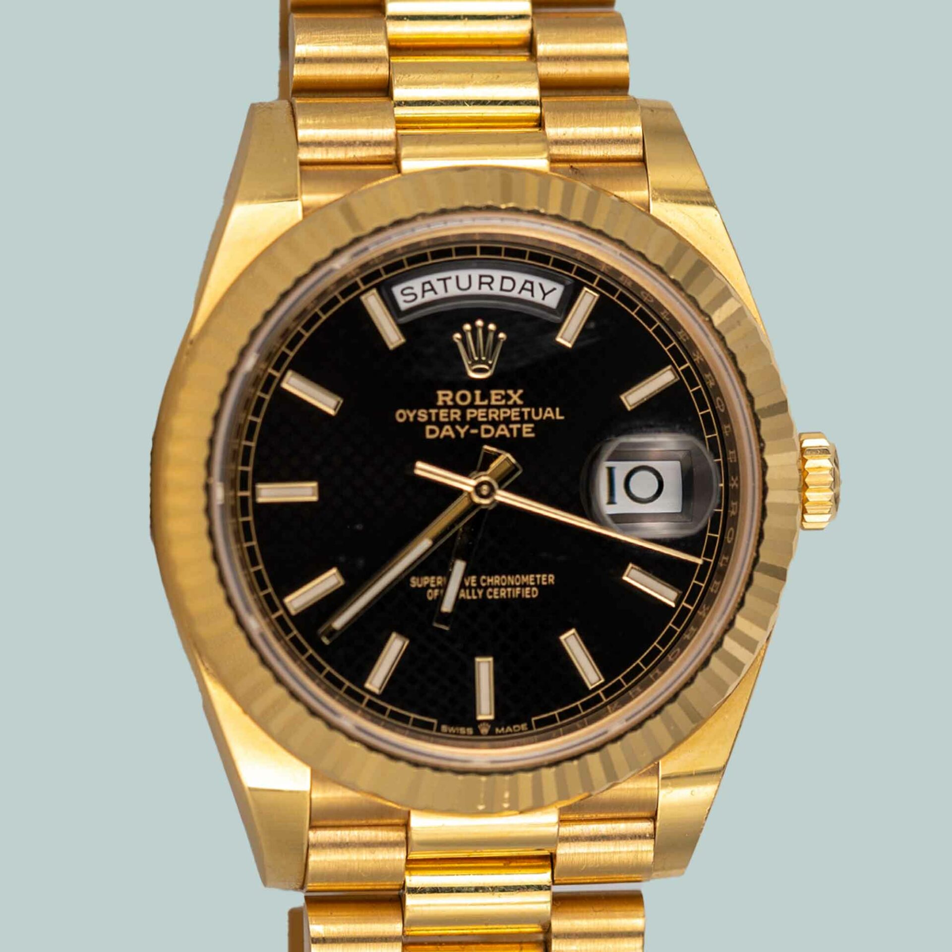 Buy Rolex Day-Date 40 Yellow Gold with Black Motif Dial